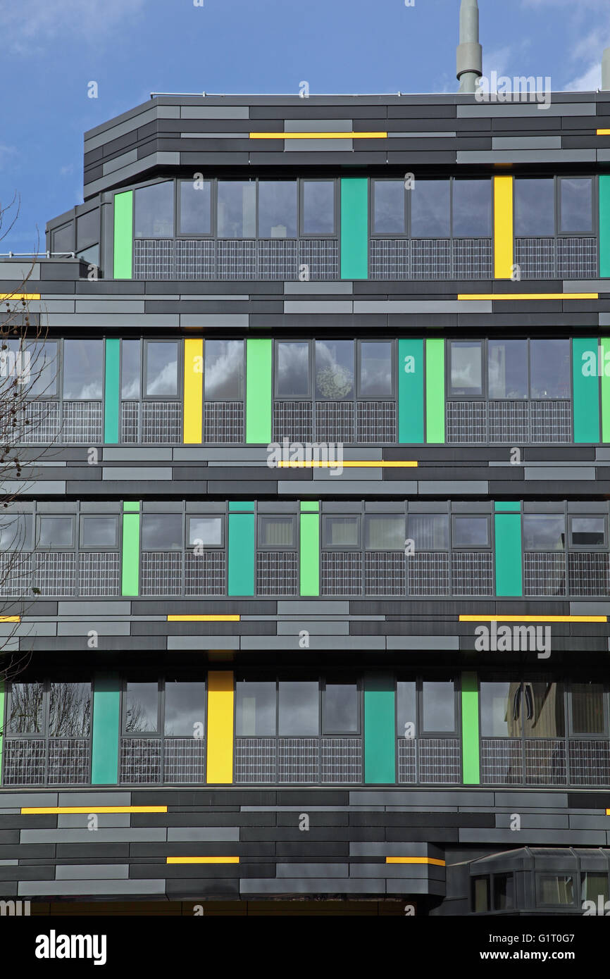 Solar panels are incorporated into the new wall cladding on the 1960's ...