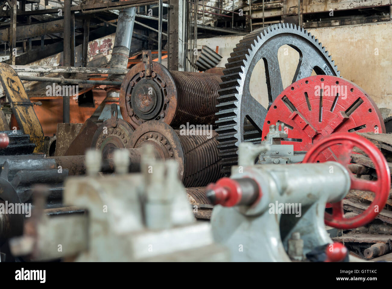 Huge cog wheel in large industrial hall Stock Photo - Alamy