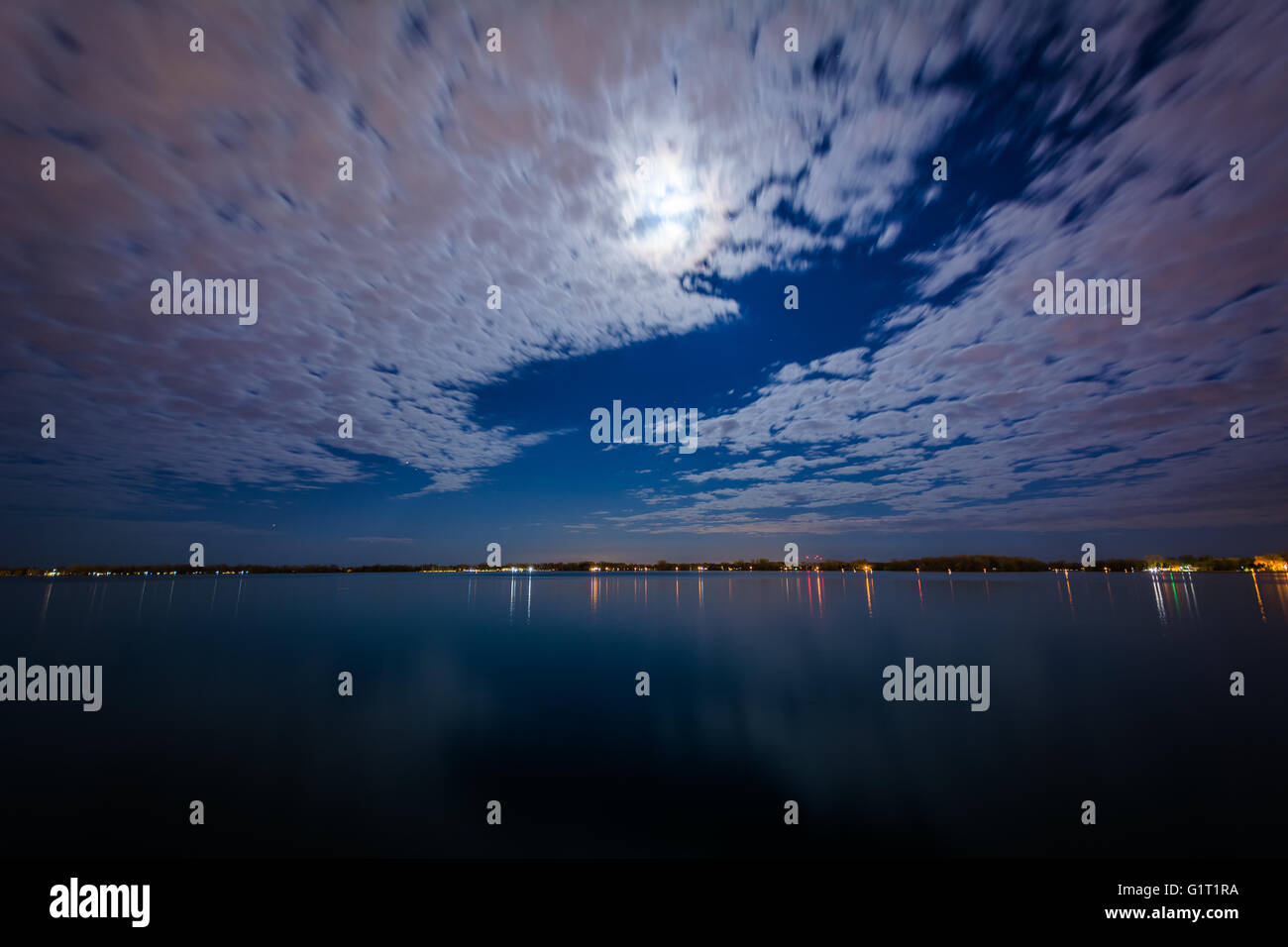 The moon and clouds moving over Lake Ontario, at the Harbourfront in ...