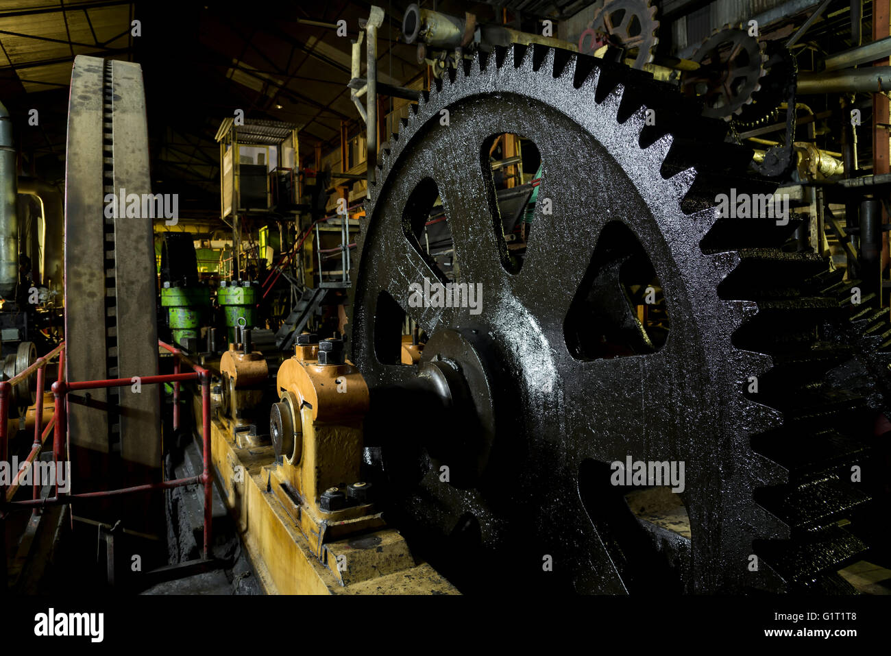 Huge cog wheel in large industrial hall Stock Photo - Alamy