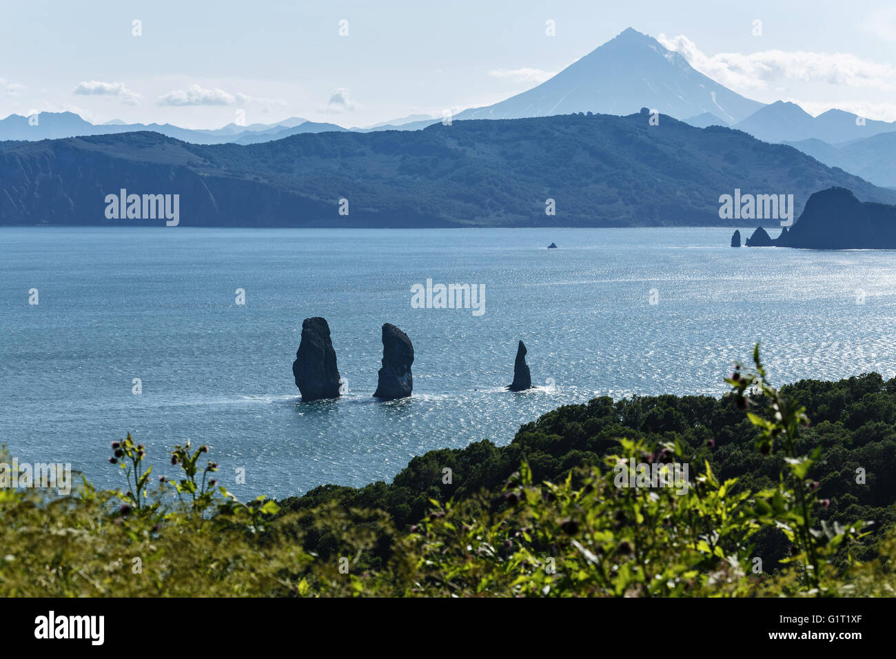 Three Brothers Rocks in Avacha Bay and Vilyuchinsky Volcano on sunny ...