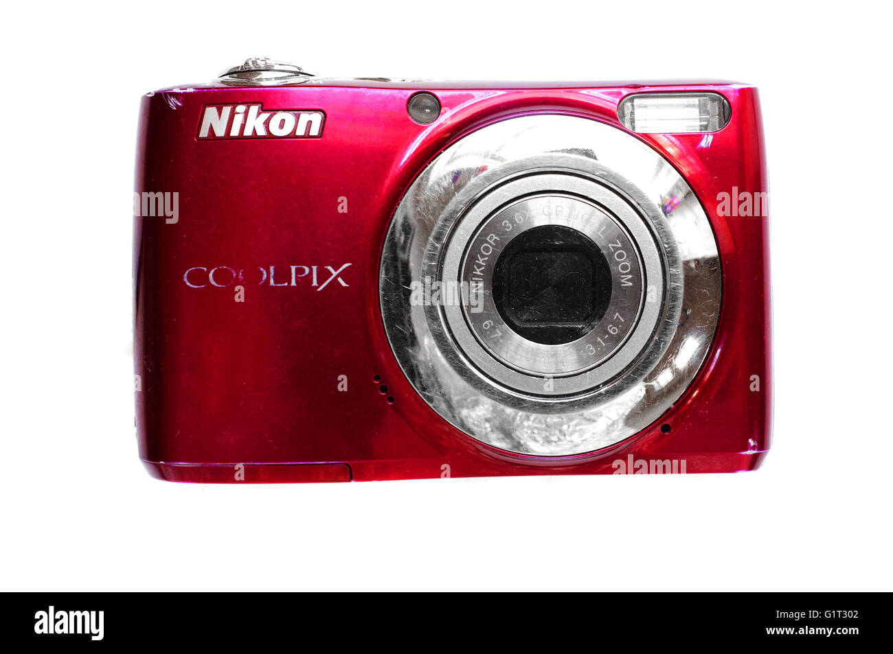 A Red Nikon digital camera photographed against a white background ...