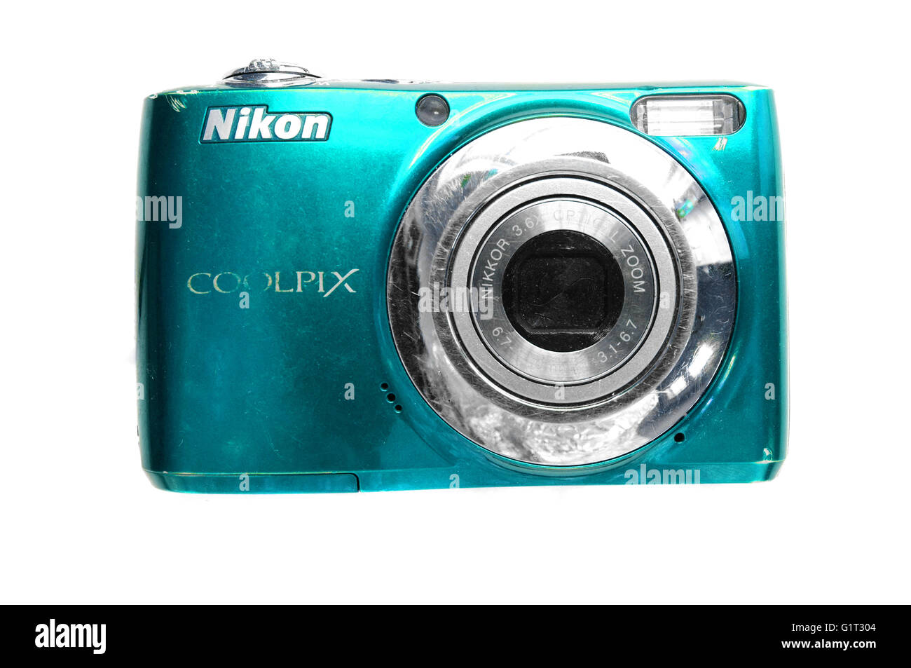 A Turquoise Nikon digital camera photographed against a white ...