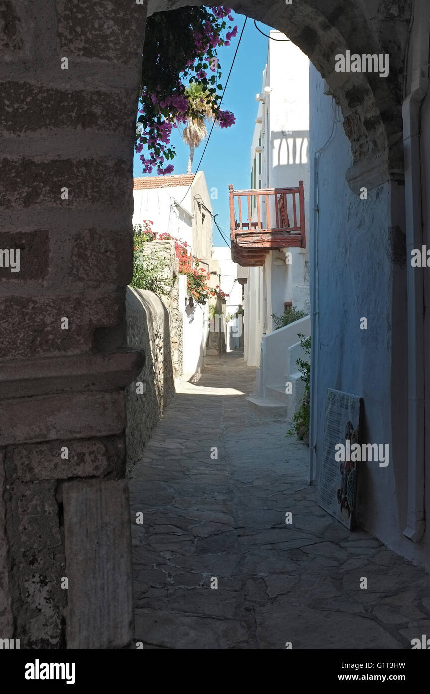 a small alley way / street with arch in naxos town/ chora naxos, the ...