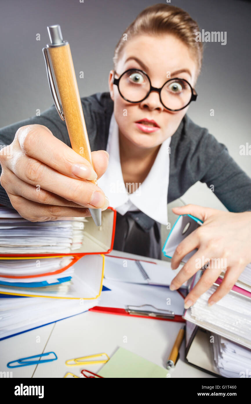 Serious young woman doing paperwork hi-res stock photography and images ...