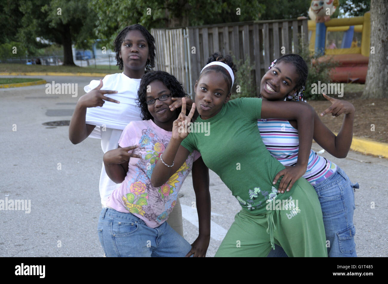 teen girls give gestures while posing for a picture Stock Photo - Alamy