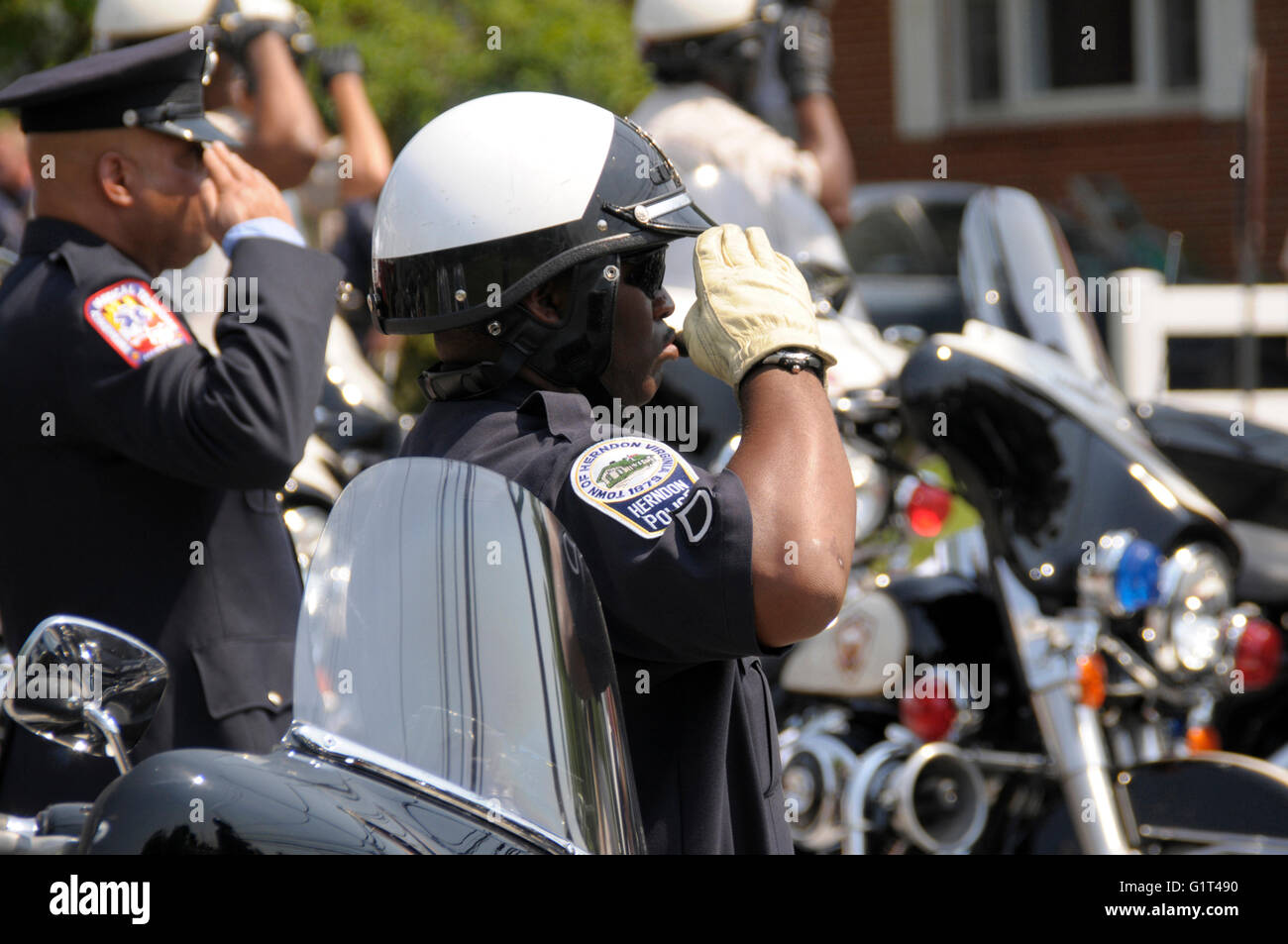 Police officer saluting hi-res stock photography and images - Alamy