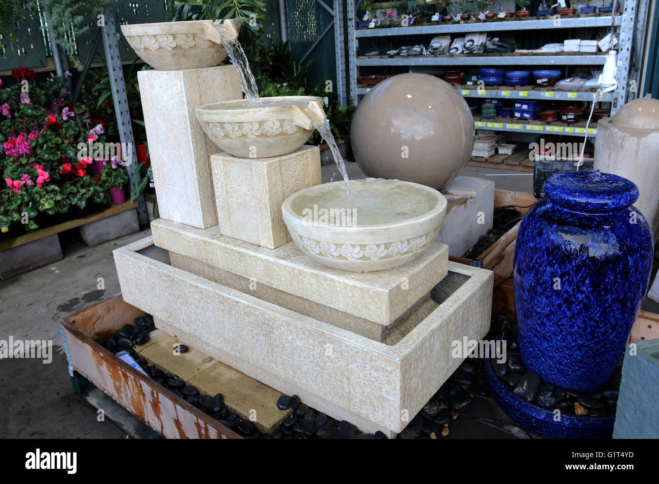 Man made Water fountains for garden decoration Stock Photo - Alamy