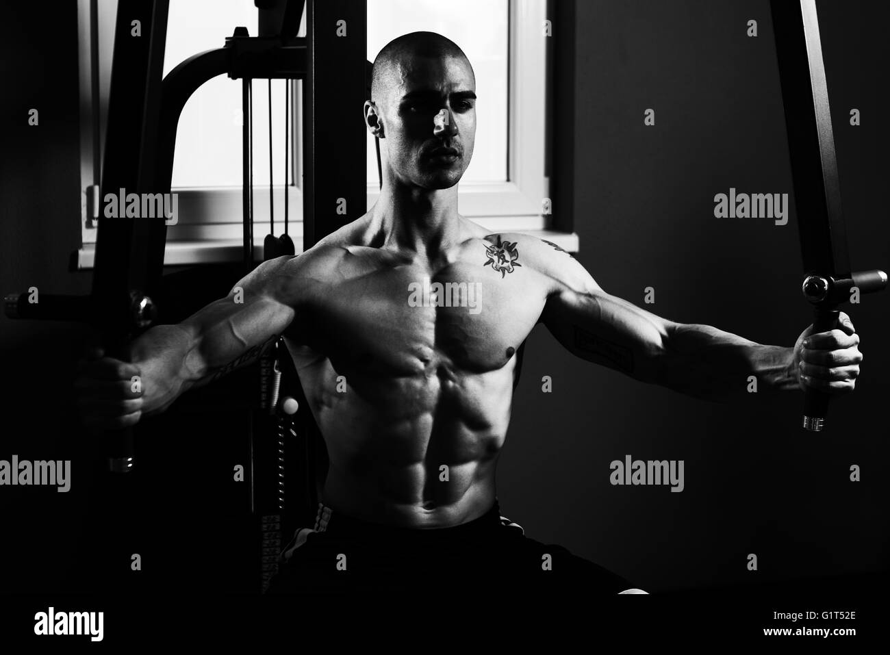 Butterfly Exercise Machine - Young Bodybuilder Doing Heavy Weight ...