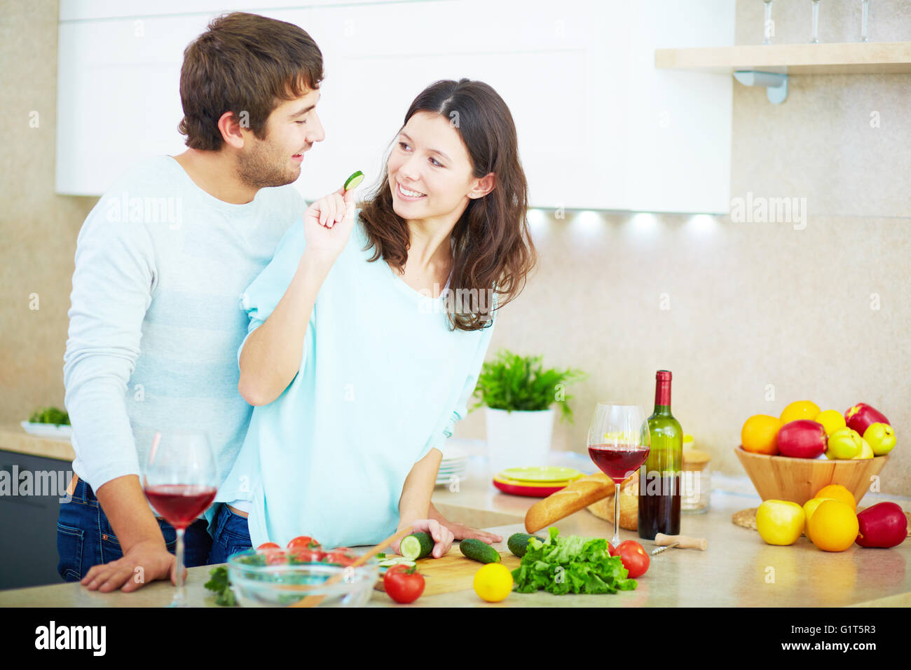 Flirtation at the kitchen Stock Photo - Alamy