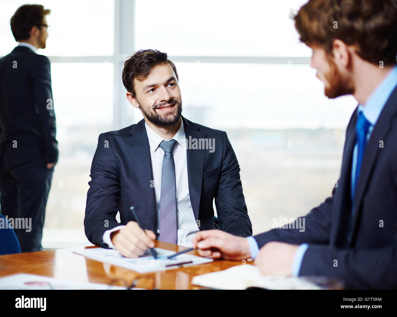 Two partners negotiating Stock Photo - Alamy