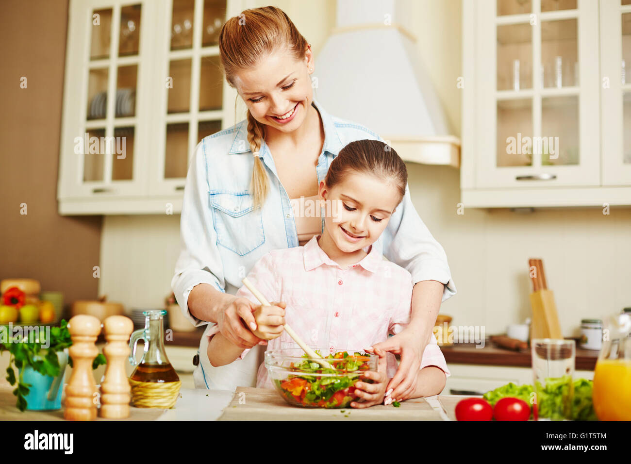 Cooking with mother Stock Photo - Alamy
