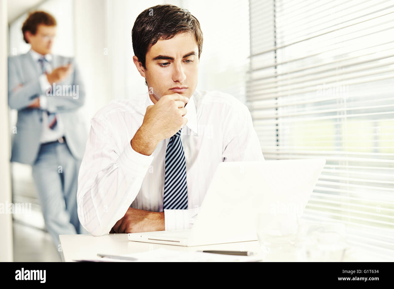 Businessman sitting and thinking hi-res stock photography and images ...