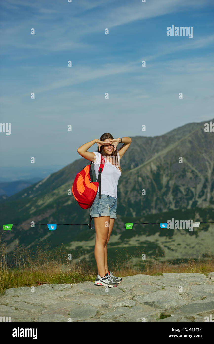 young beautiful girl climbing the rock Stock Photo - Alamy