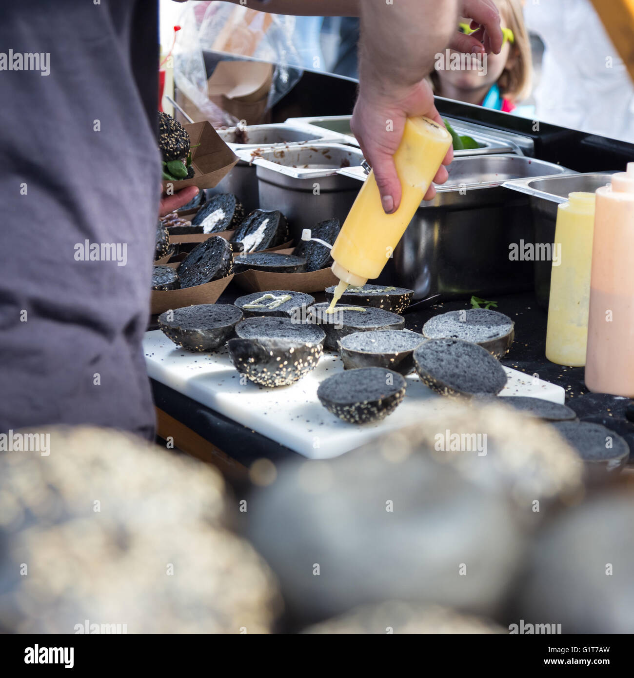 Burgers ready to serve on food stall Stock Photo - Alamy