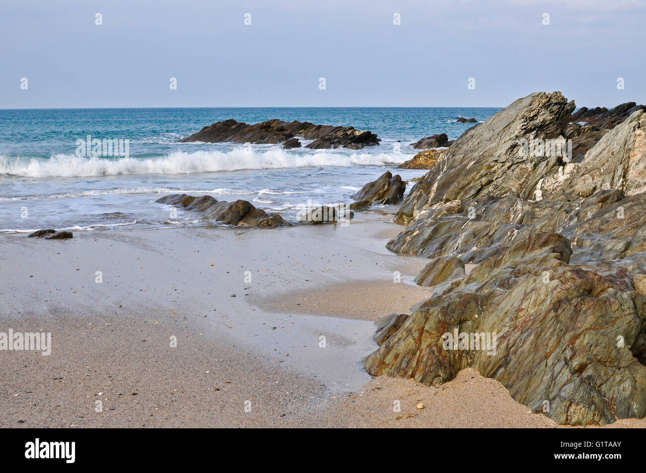 Surf crashing on the rocks of Fistral Beach near Newquay in Cornwall ...