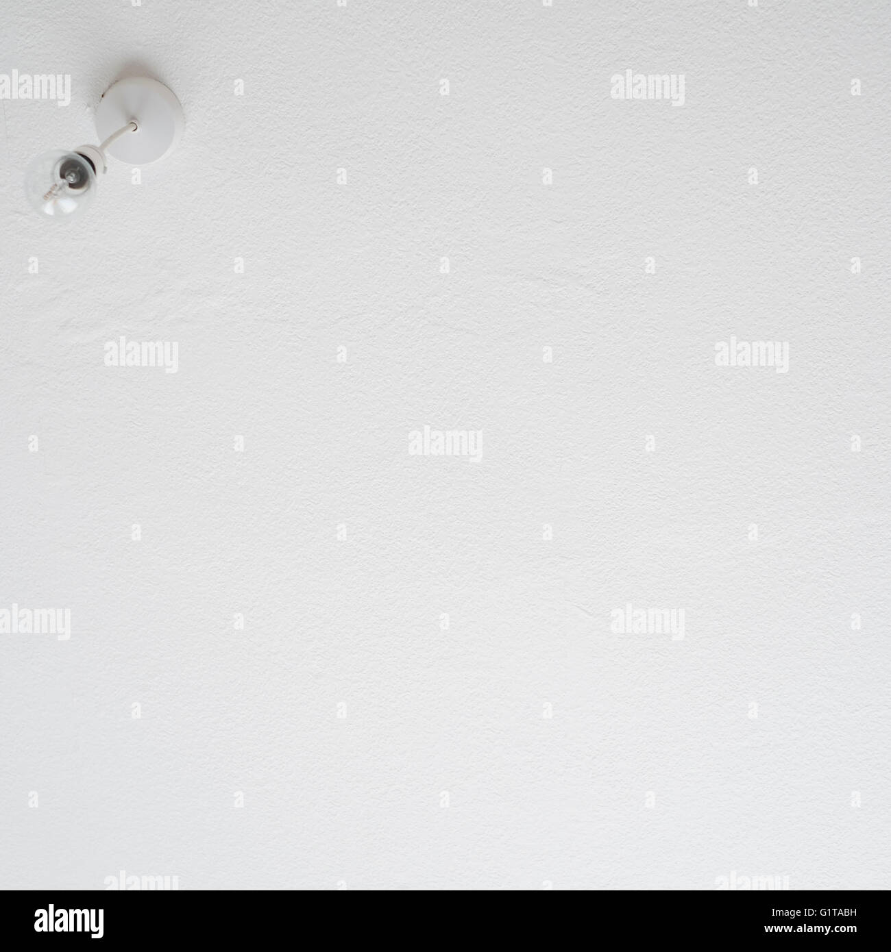 A bare light fitting in a white ceiling Stock Photo - Alamy