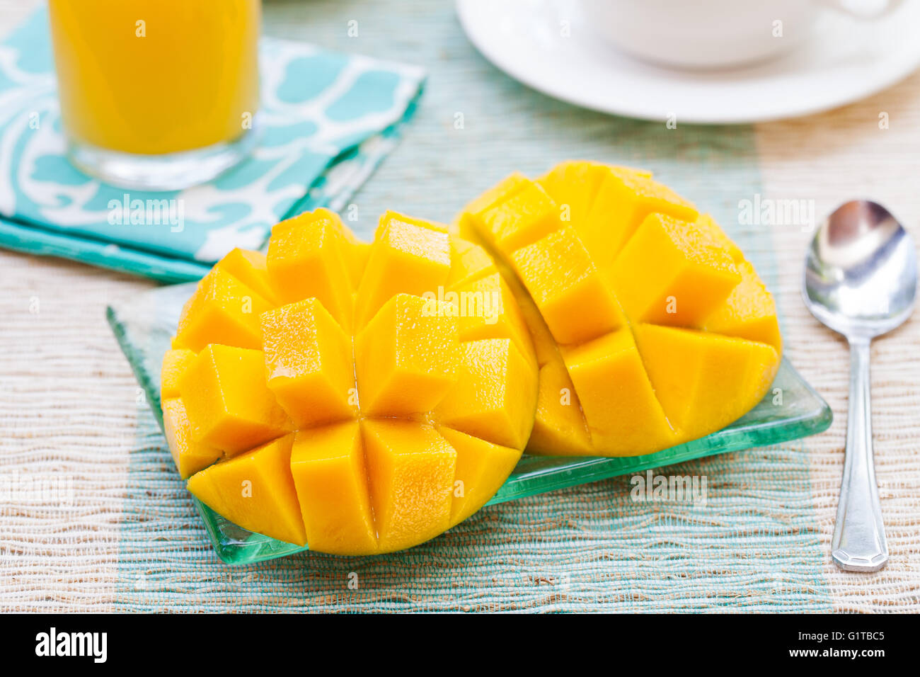Healthy breakfast Fresh tropical fruit mango and orange juice, coffee ...