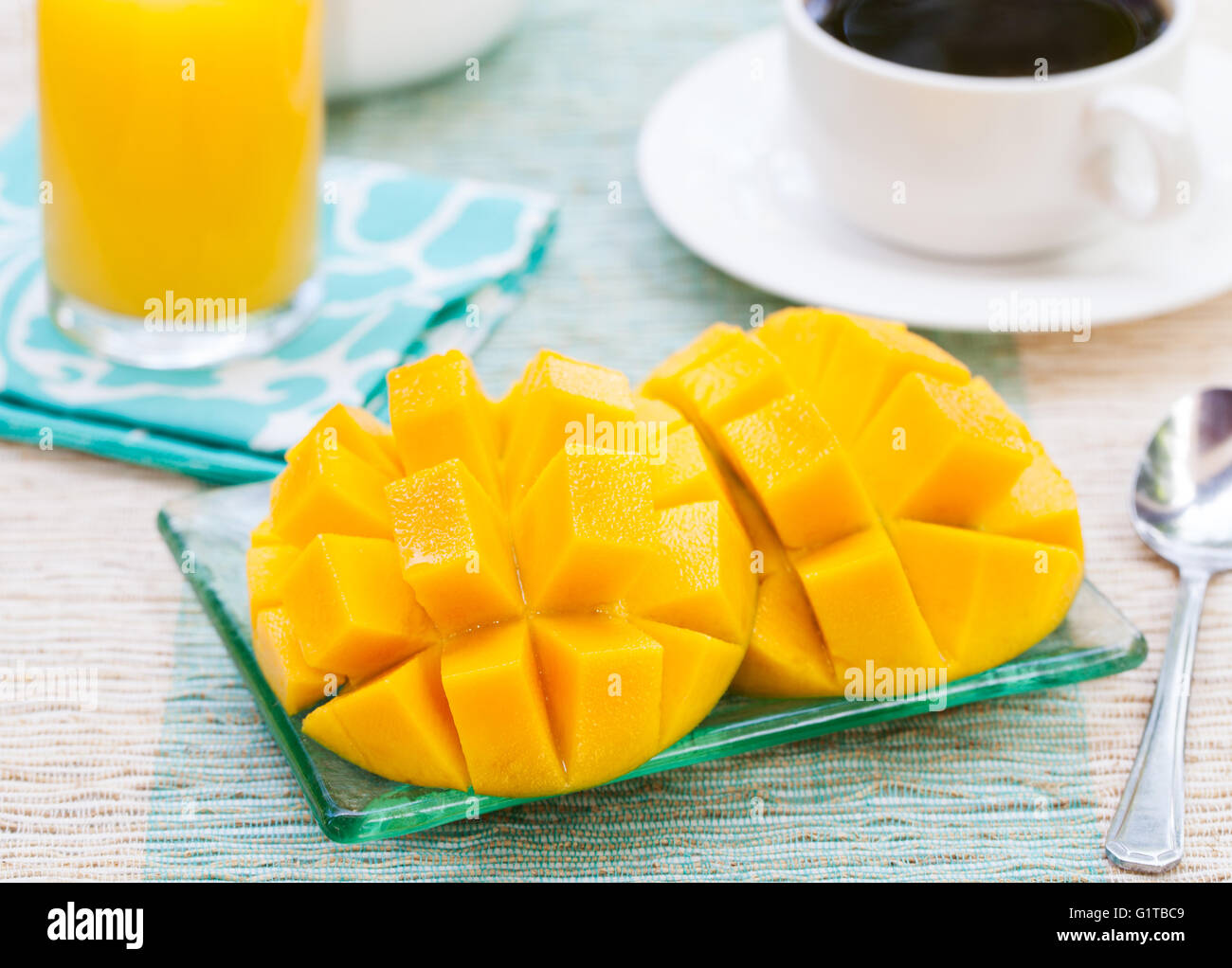 Healthy breakfast Fresh tropical fruit mango and orange juice, coffee ...