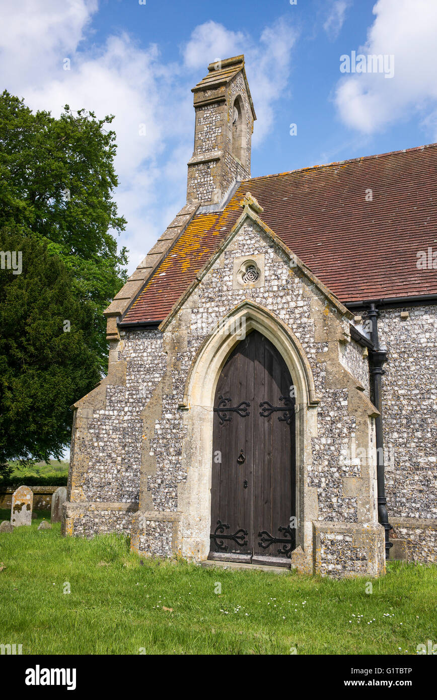 Vernacular architecture using flint stones on the porch, bell tower and ...
