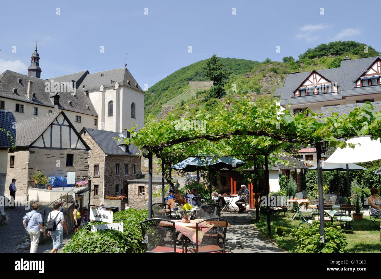 A wine cafe behind the Church of St Joseph in Beilstein, on the Moselle ...