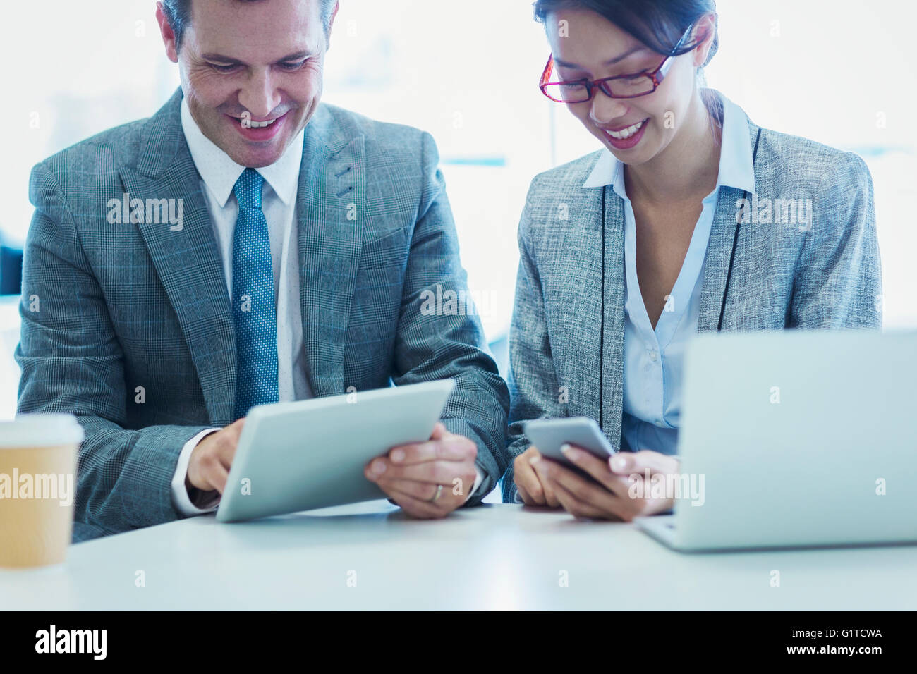 Business meeting checking mobile phone hi-res stock photography and ...