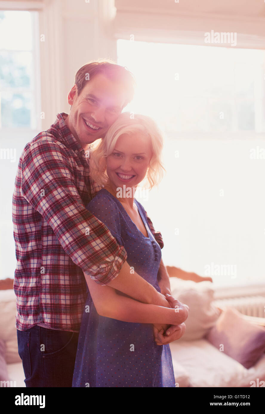 smiling couple hugging Stock Photo - Alamy