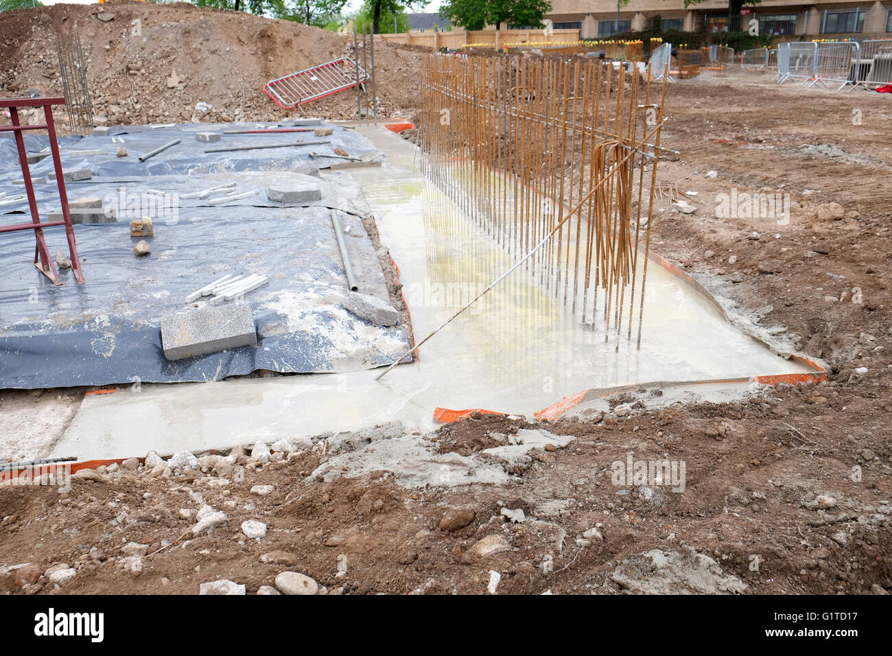 Freshly poured concrete for the foundations of a new tall building in ...