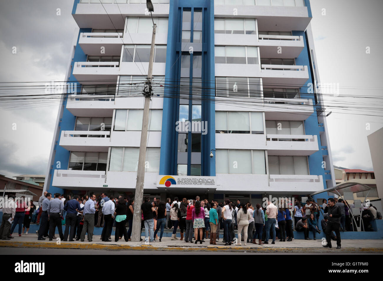 Quito, Ecuador. 18th May, 2016. Citizens gather outside their offices ...