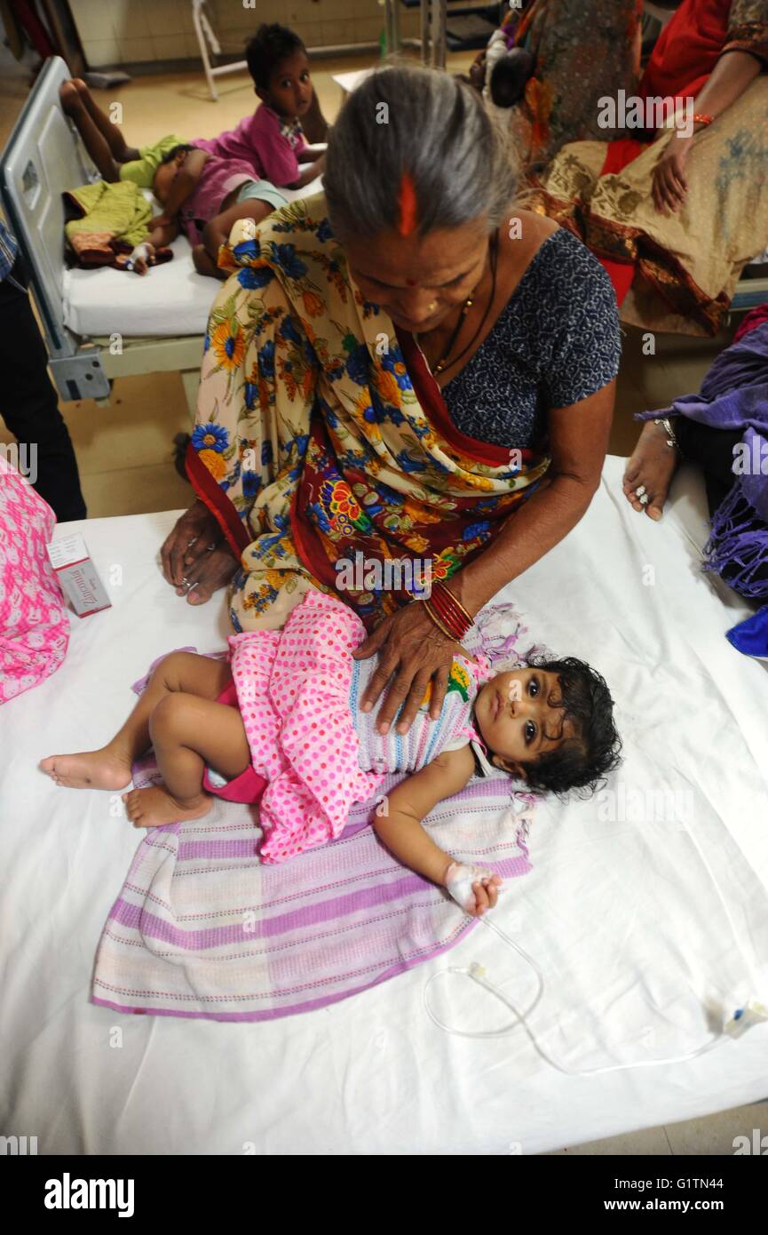Allahabad, India. 19th May, 2016. A woman take care of her child ...