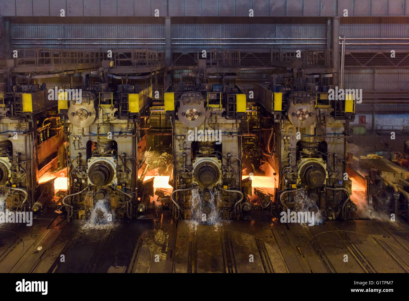 Esfahan, Iran. 19th May, 2016. Glowing steel rolls through a mill at ...