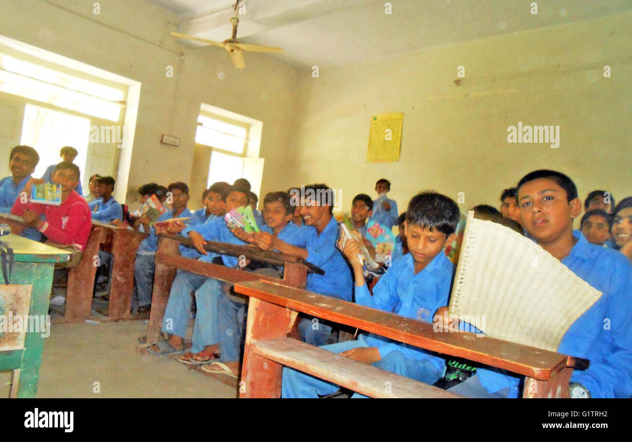 Children using hand fans during classes while prolong load shedding at ...