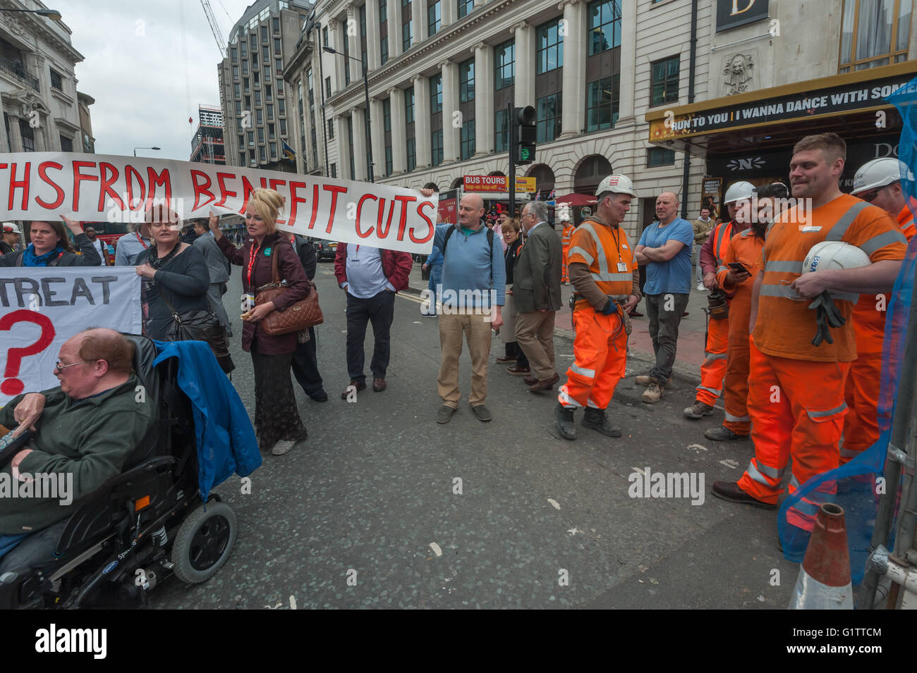 London, UK. 19th May, 2016. Construction workers watch as delegates at ...
