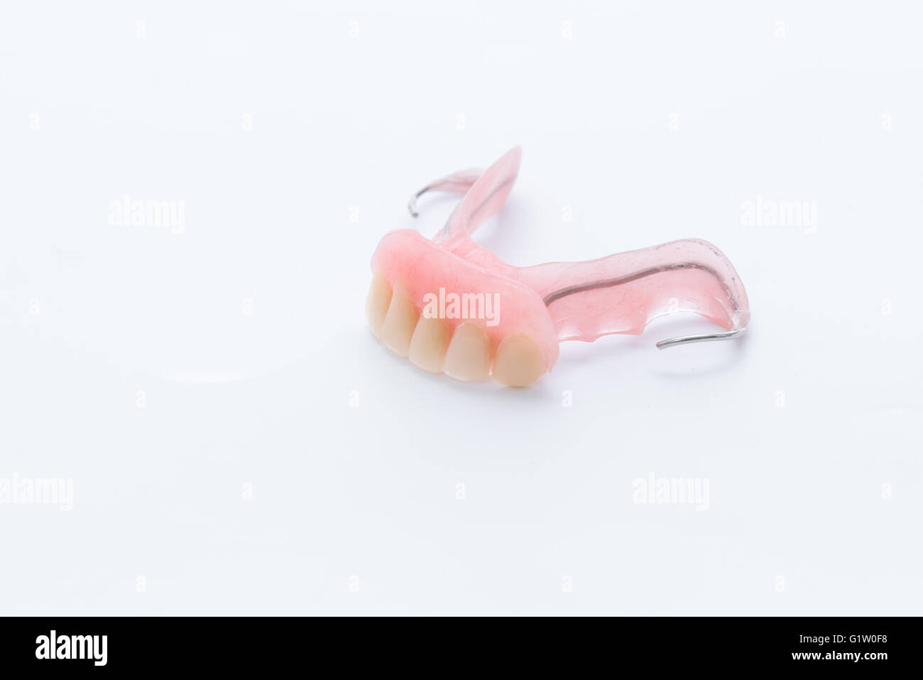 Acrylic denture on white background Stock Photo - Alamy