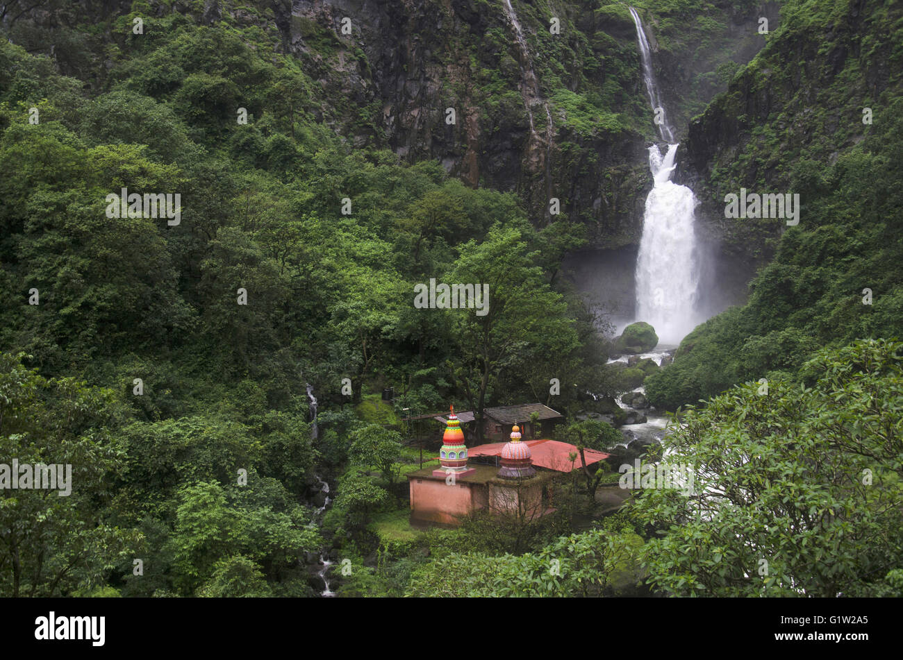 View of a temple and waterfall in the background in rainy season, Near ...