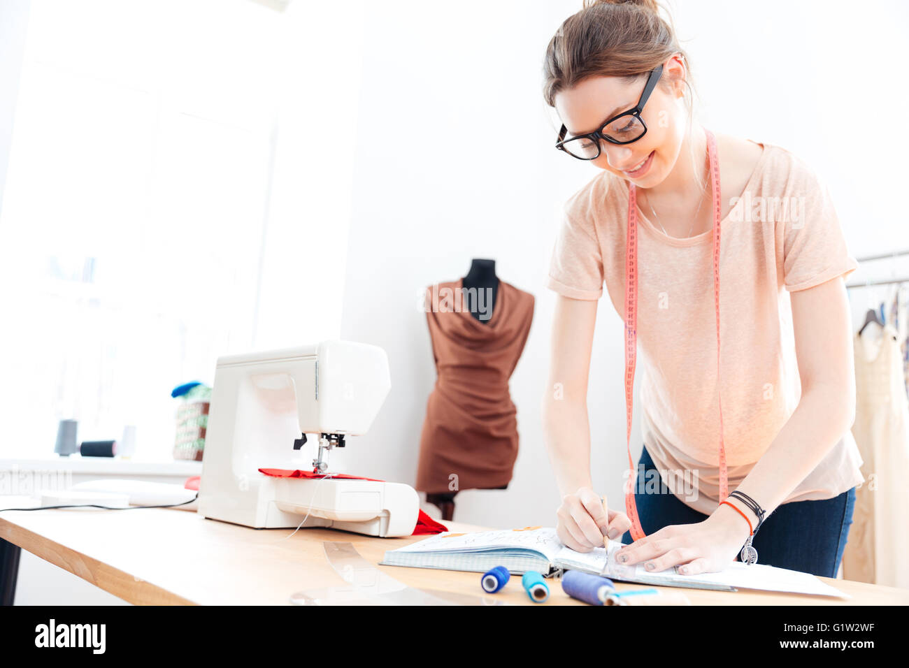 Female seamstress drawing sewing hi-res stock photography and images ...