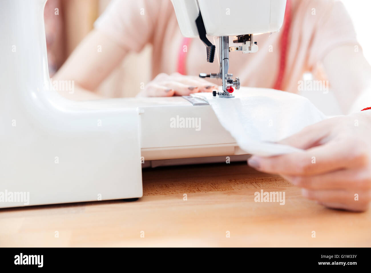 Woman sewing machine pink hi-res stock photography and images - Alamy