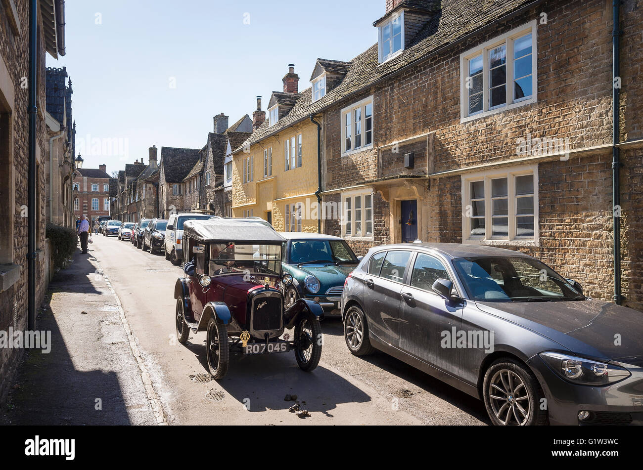 Old 1920s Austin 7 driving through historic Lacock village UK Stock ...