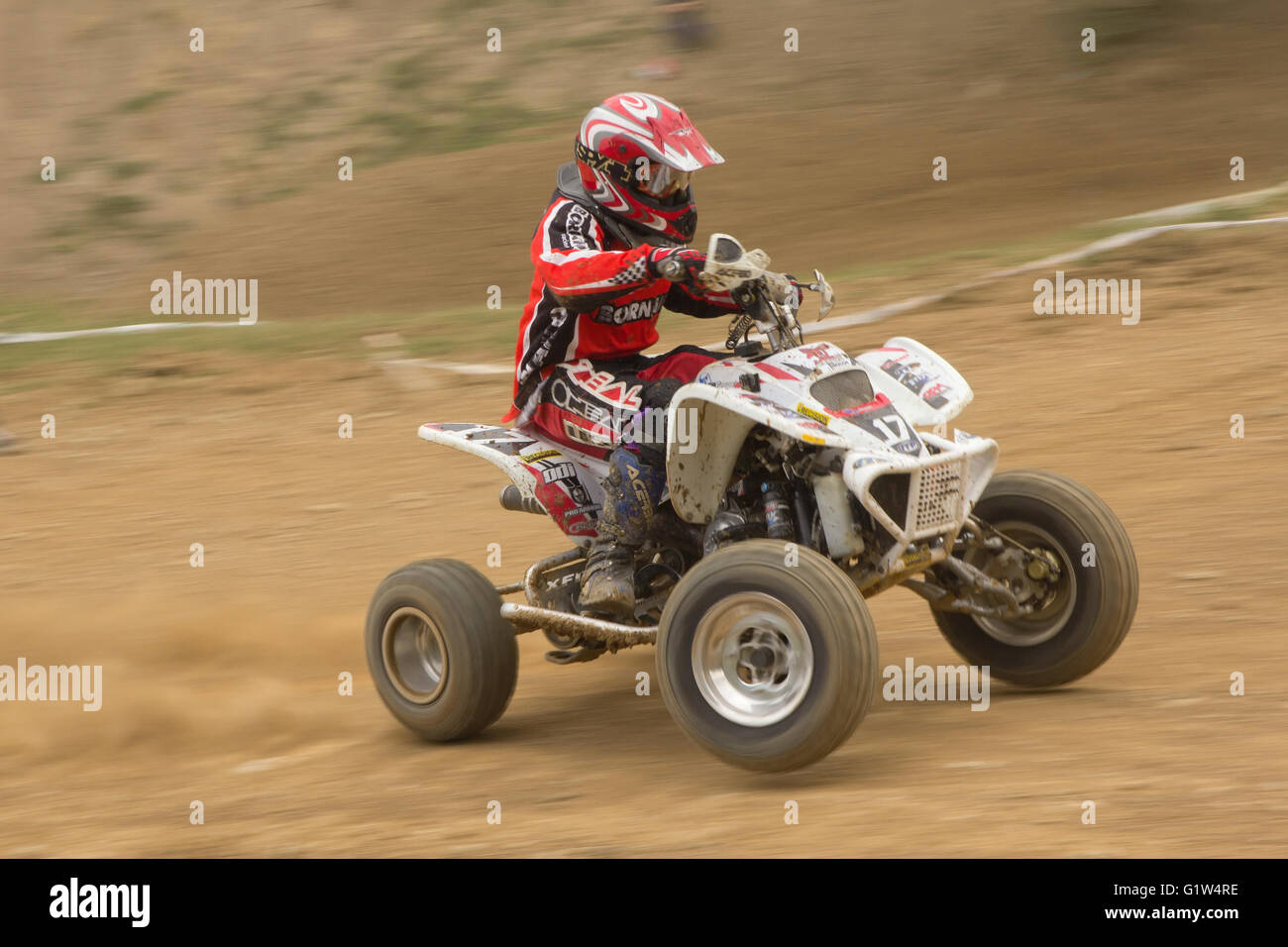 Unidentified racer rides a white quad motorbike Stock Photo - Alamy