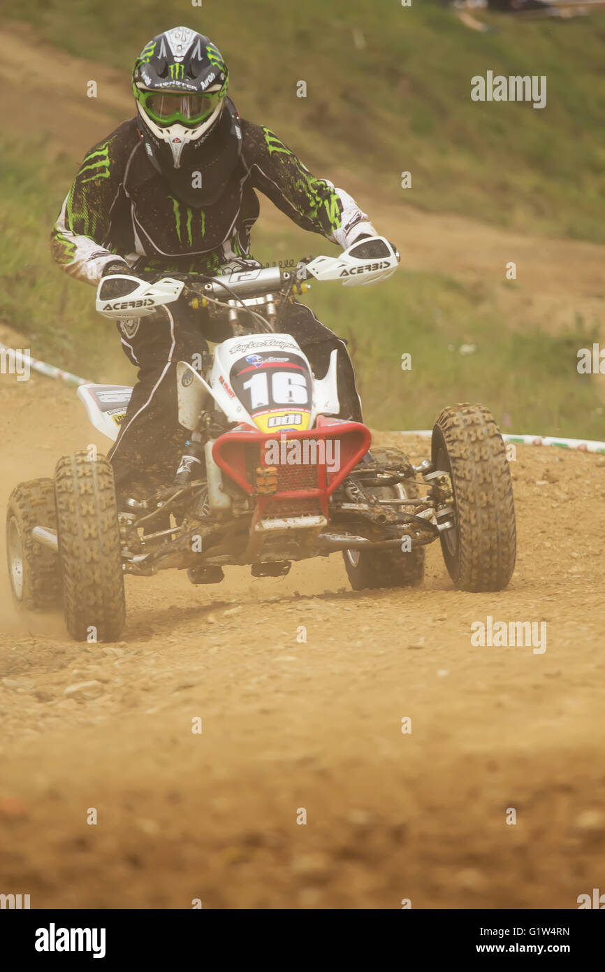 Unidentified racer rides a quad motorbike Stock Photo - Alamy