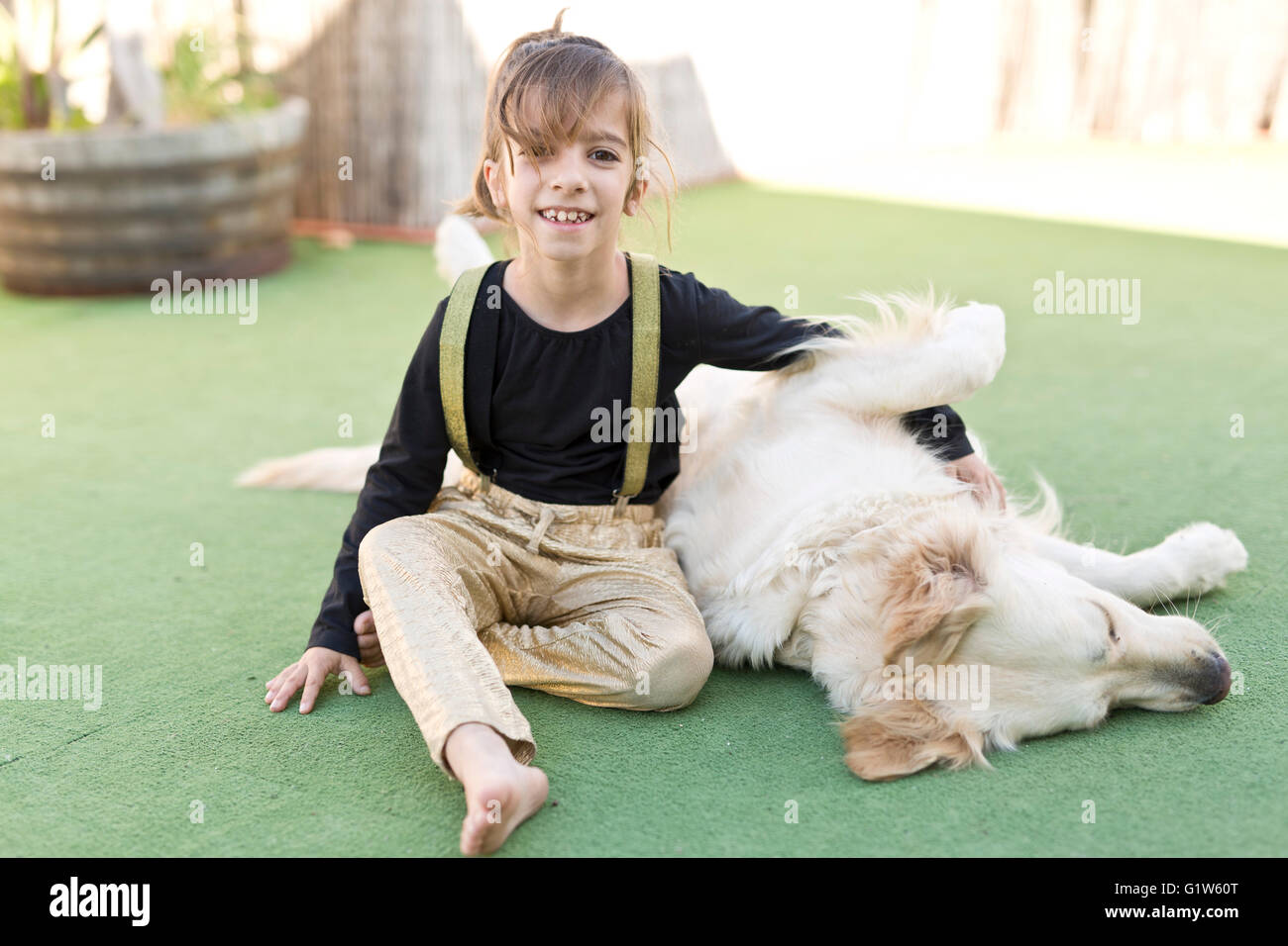 Little girl with her dog with signs of affection Stock Photo - Alamy