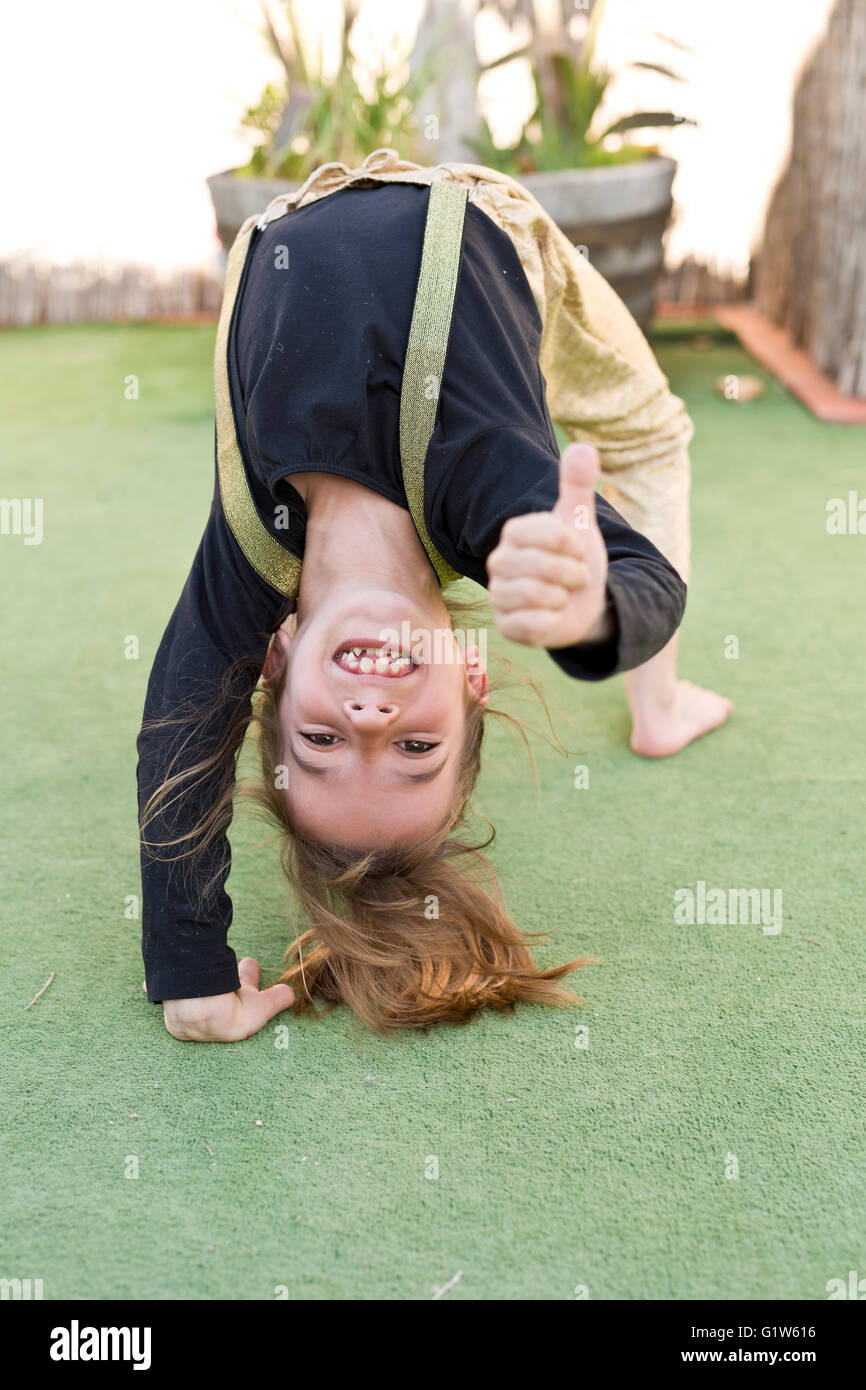 One girl playing on a floor with Astroturf Stock Photo - Alamy