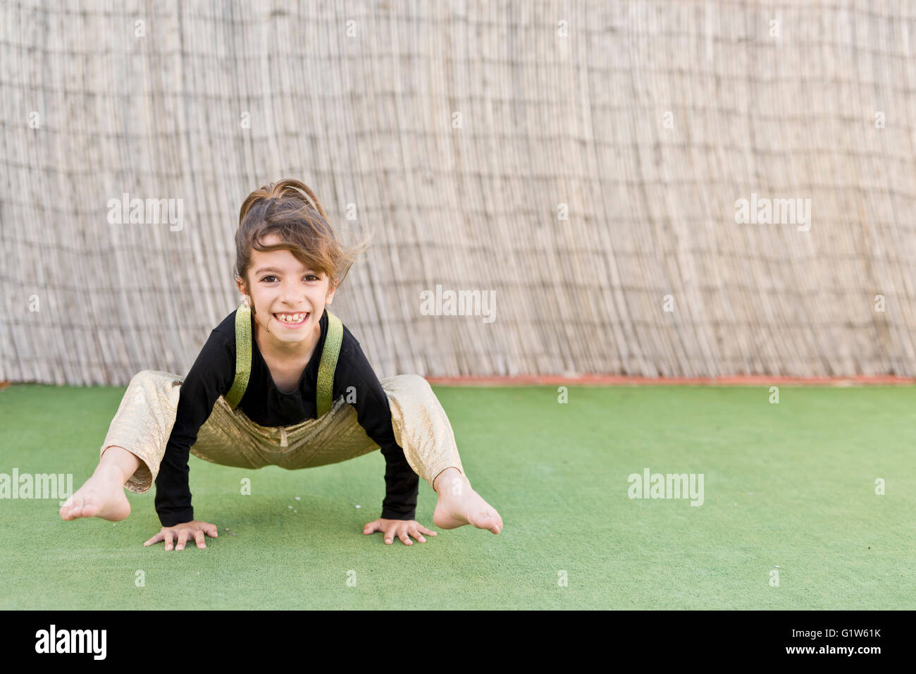 One girl playing on a floor with Astroturf Stock Photo - Alamy