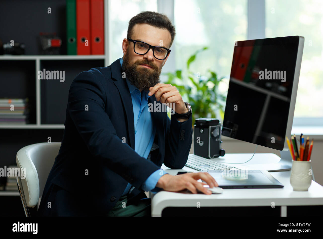 Handsome young man working from home office - modern business concept ...