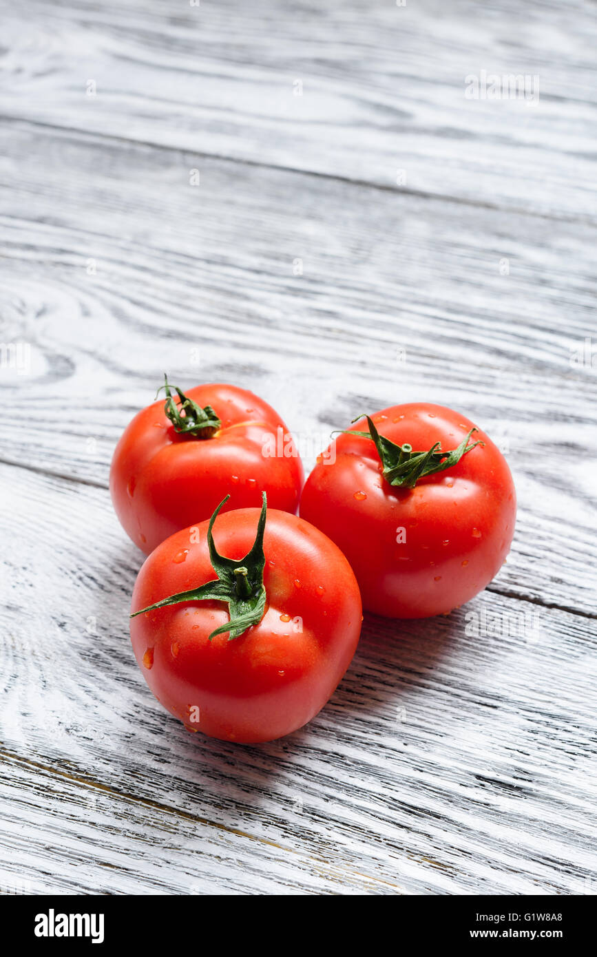 three red tomatoes Stock Photo - Alamy