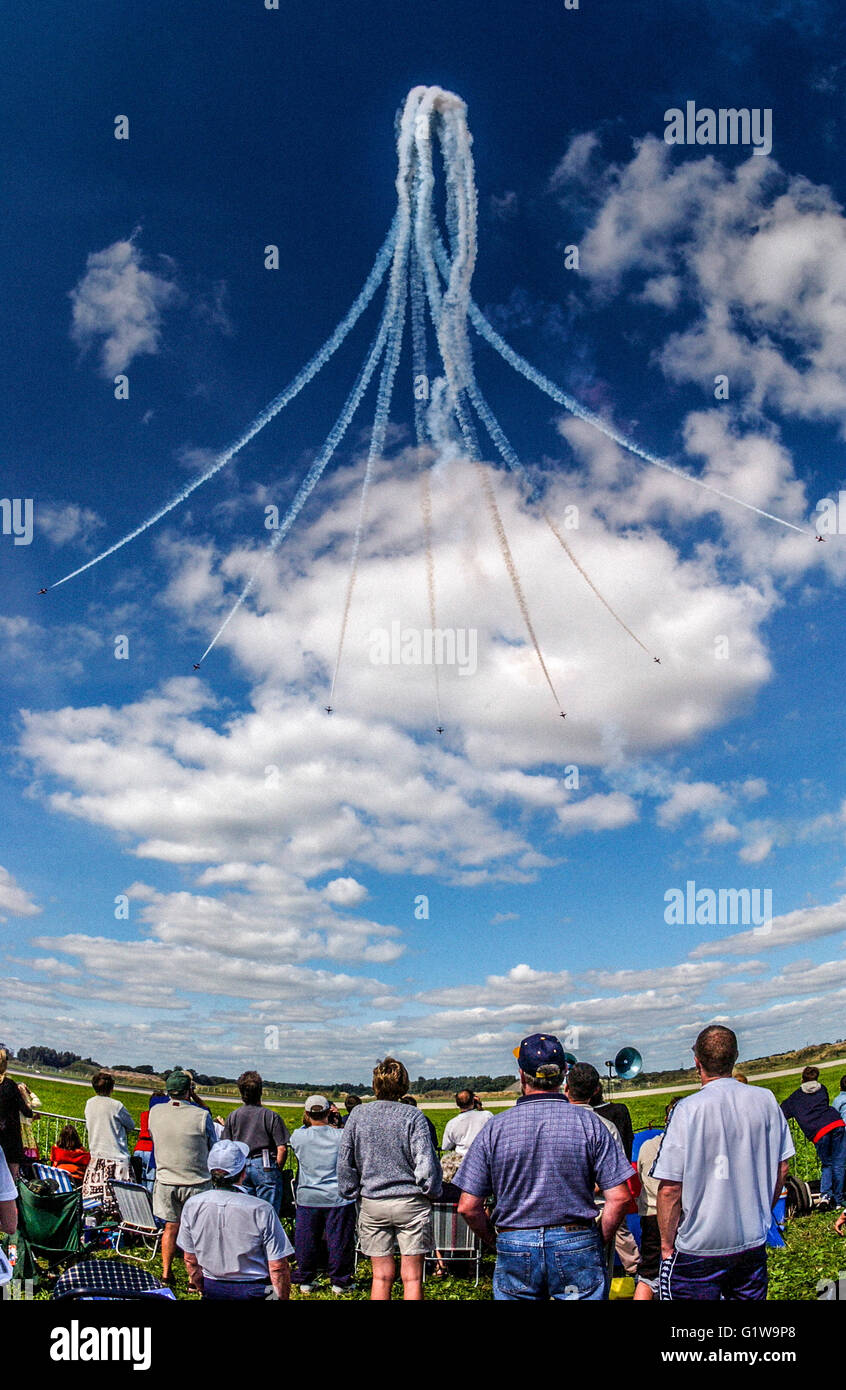 Crowd watching Red Arrows Display Team. BAE SYSTEMS Hawk T1 aircraft ...
