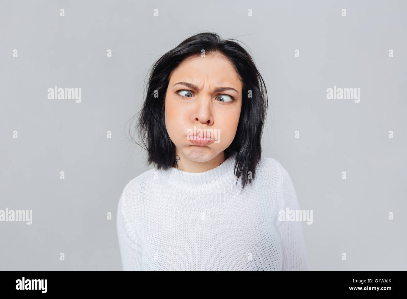 Woman making funny crazy face, isolated on white background Stock Photo ...