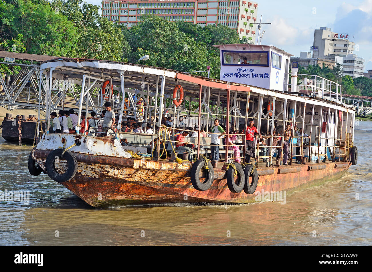 Passenger boats and jetty on Hooghly river, Kolkata, West Bengal, India ...