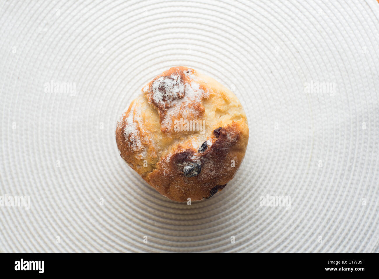 Homemade carrot muffin with empty space on white fabric background ...