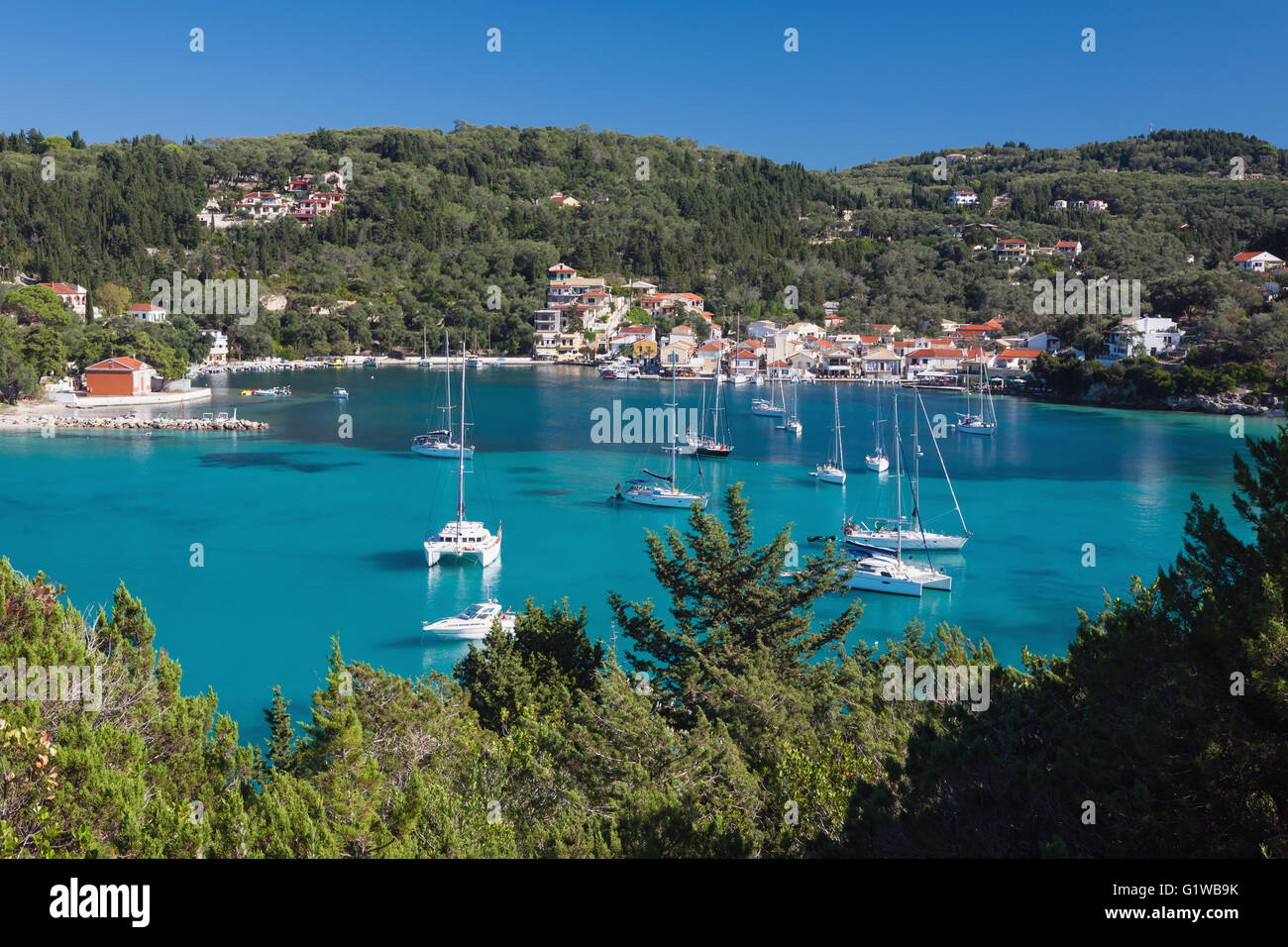 The pretty little harbourside village of Lakka, Paxos, Greece in its ...